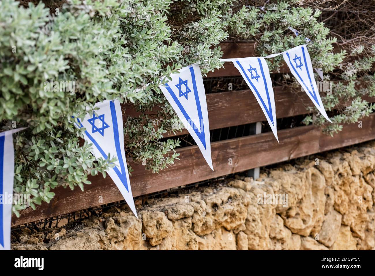 Wooden fence with flags of Israel outdoors, closeup Stock Photo - Alamy
