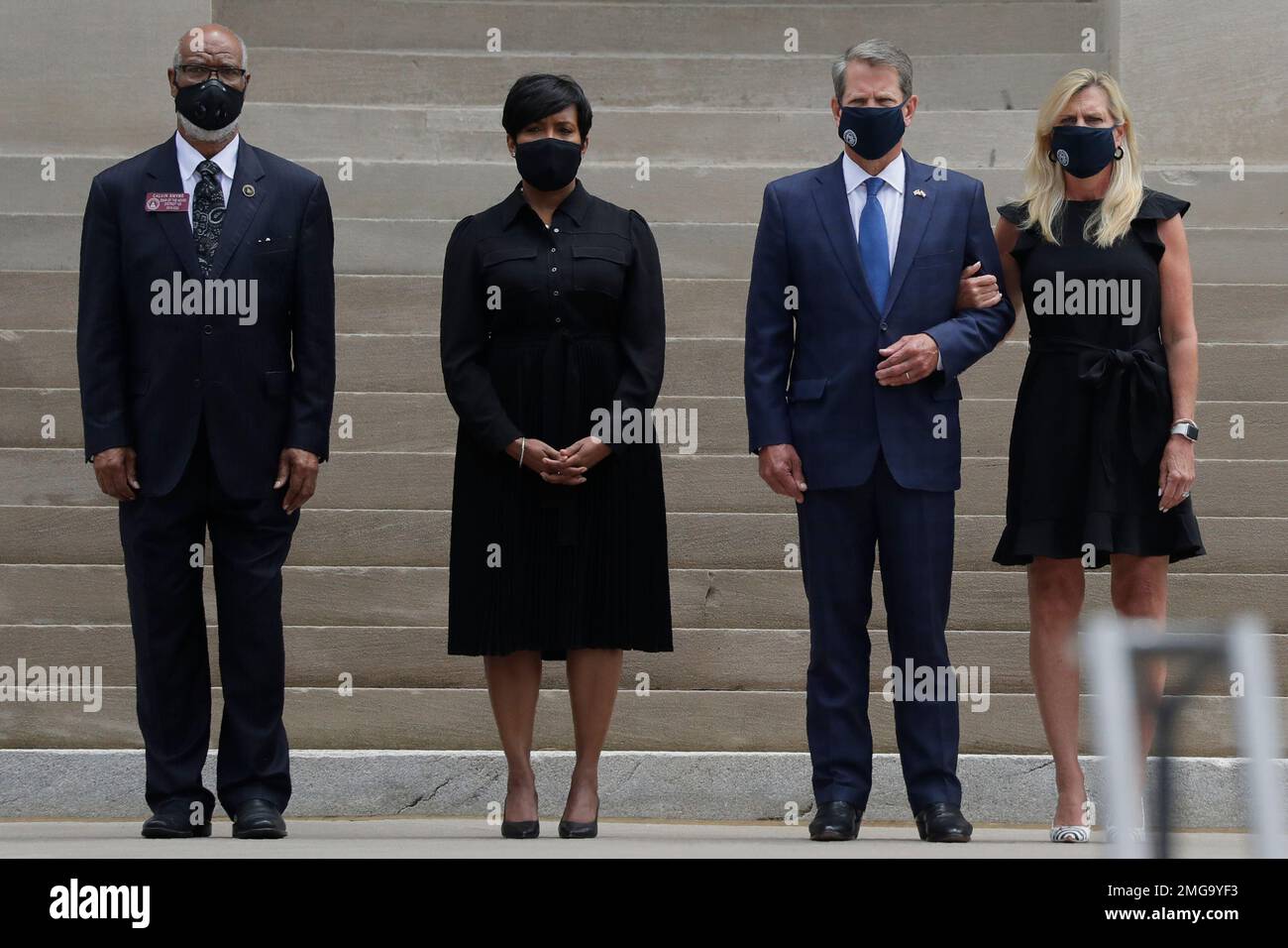 Georgia Gov. Brian Kemp, second from right, his wife Marty Kemp, right ...