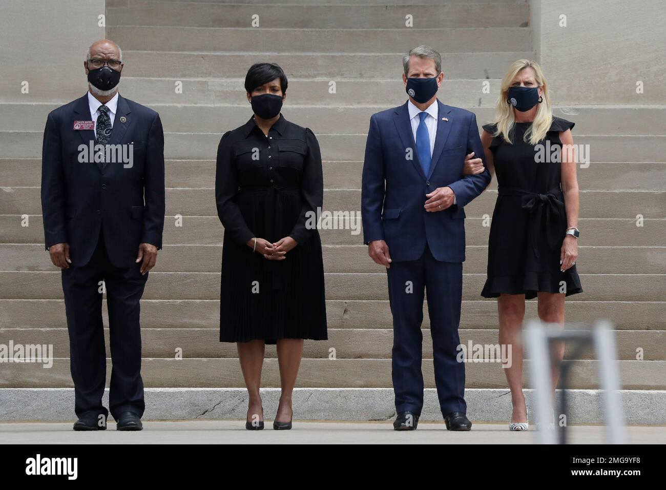 Georgia Gov. Brian Kemp, second from right, his wife Marty Kemp, right ...