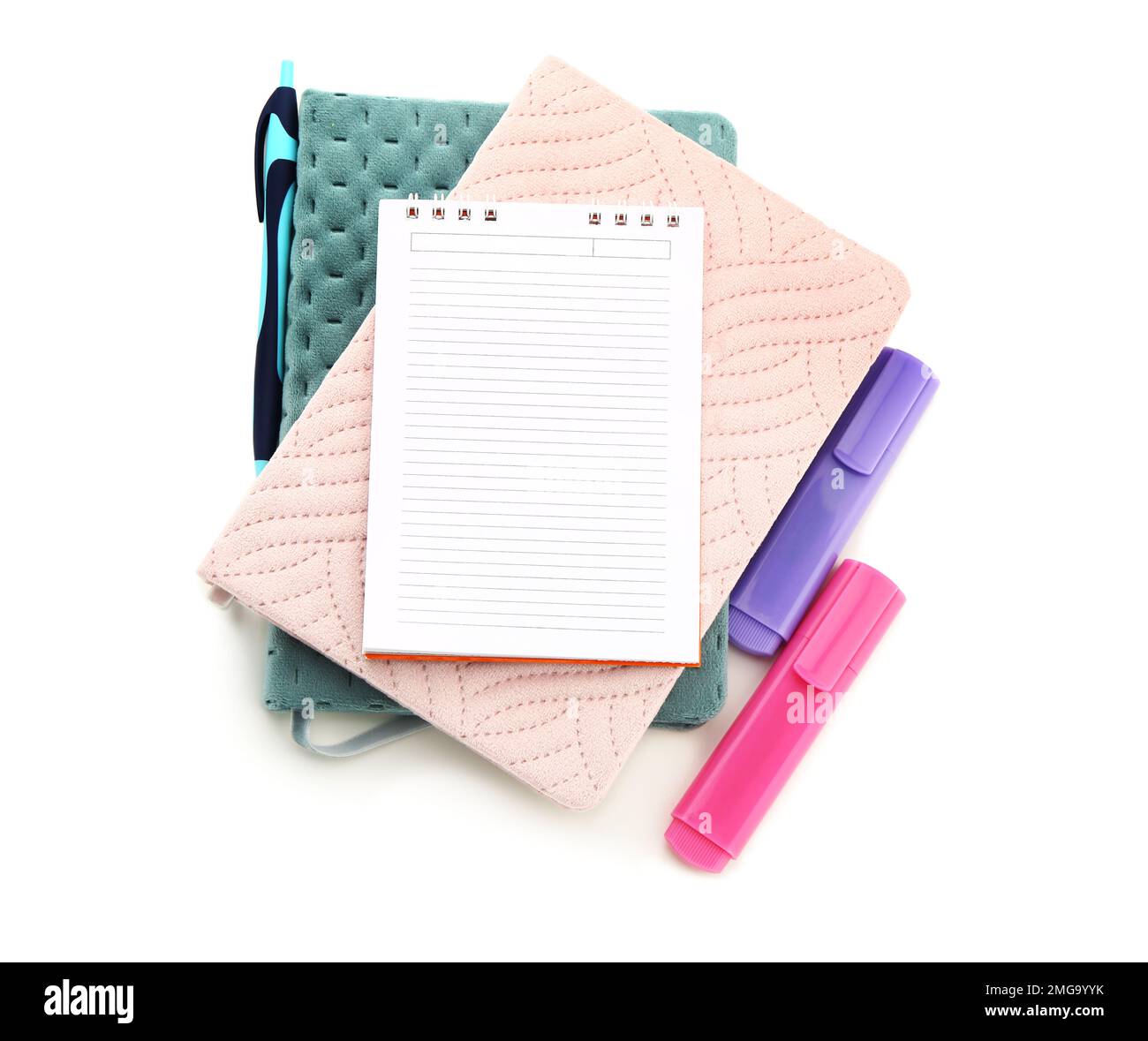 Stack of notebooks and markers on white background Stock Photo - Alamy