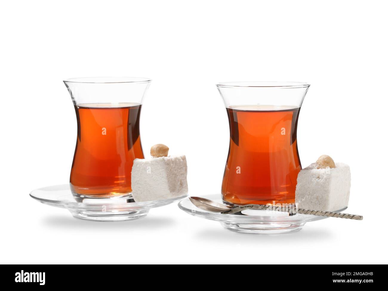 Glass cups of Turkish tea and sweets on white background Stock Photo ...