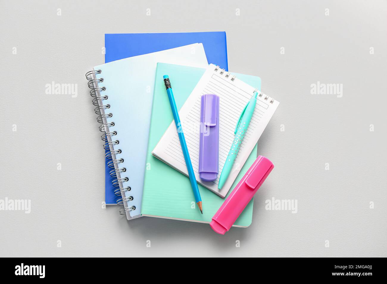 Notebooks, pen, pencil and markers on light background Stock Photo - Alamy