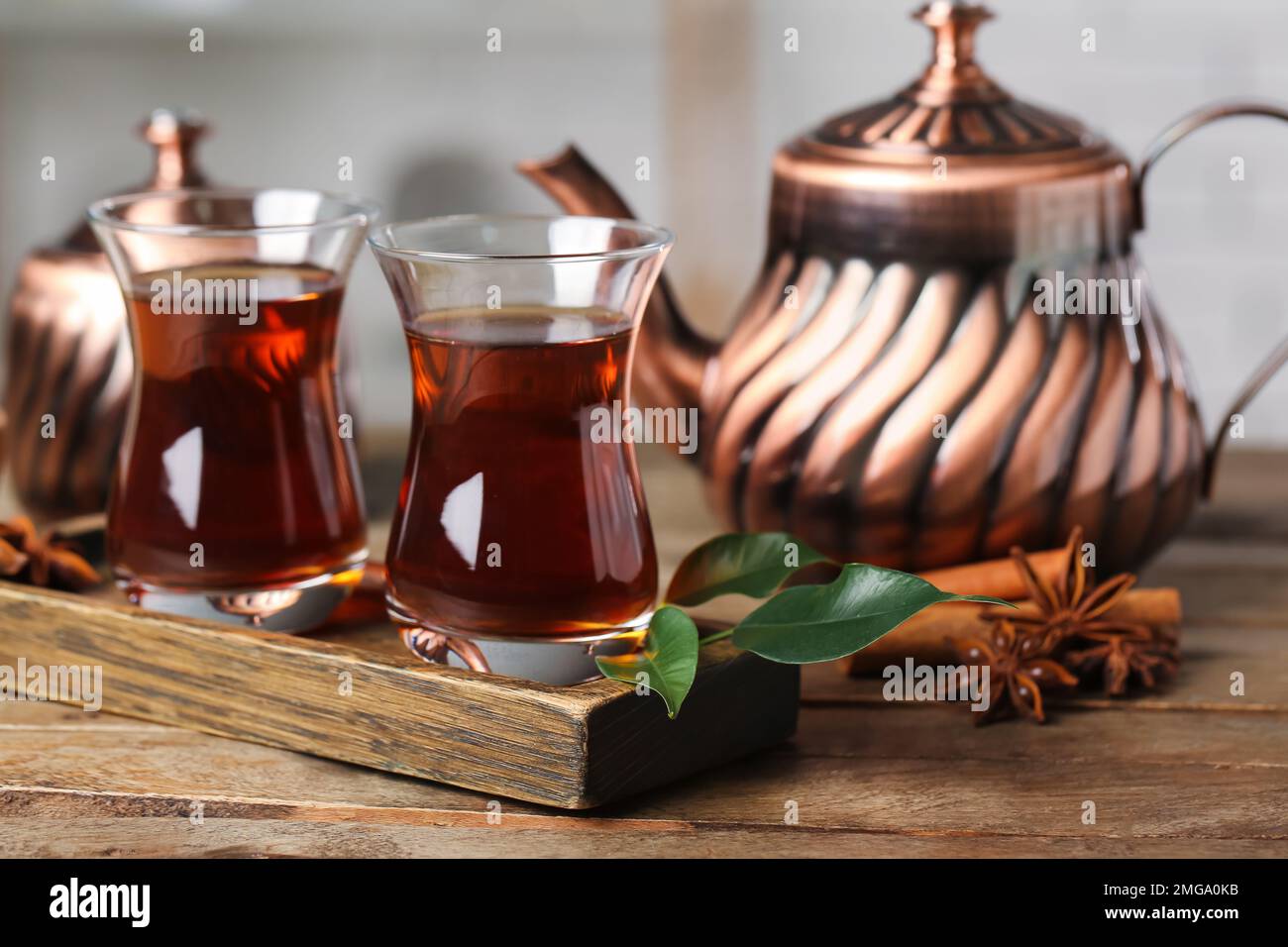 Board with cups of Turkish tea on wooden table, closeup Stock Photo - Alamy