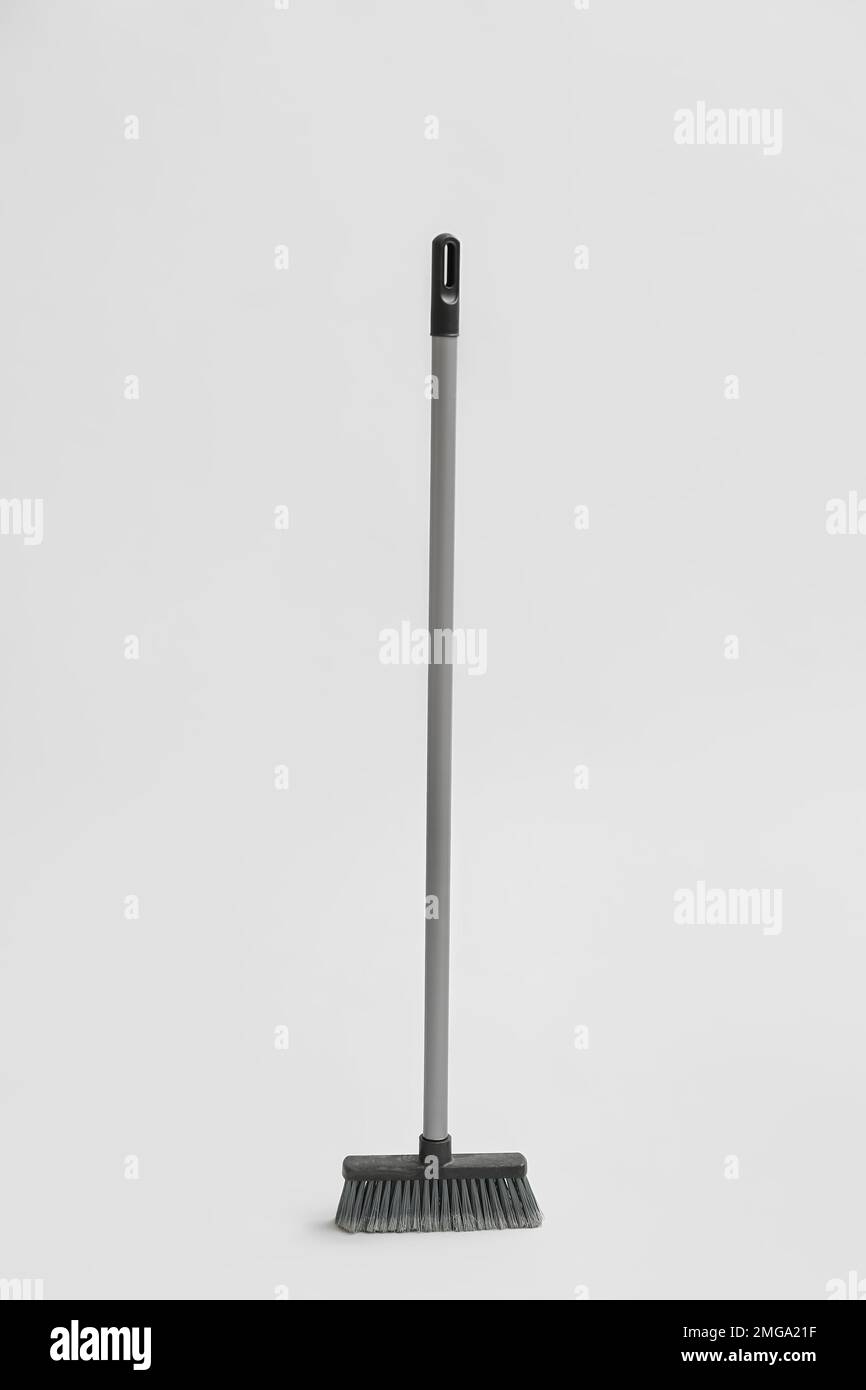 Sweeping broom on white background Stock Photo - Alamy