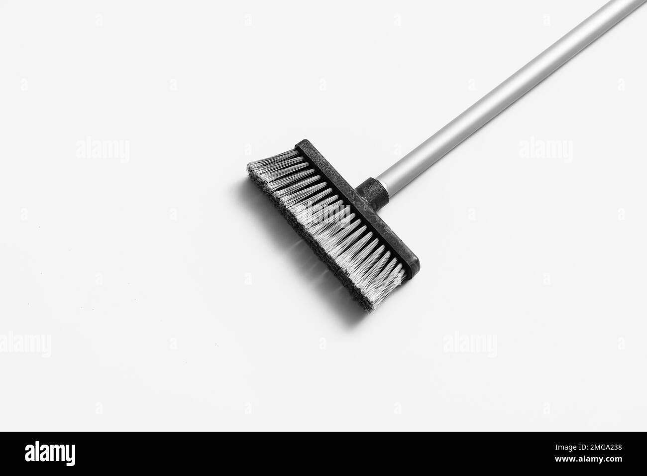 Sweeping broom on white background Stock Photo - Alamy