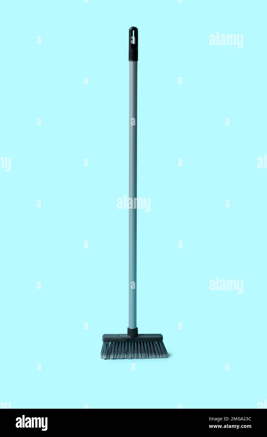 Plastic sweeping broom on color background Stock Photo - Alamy