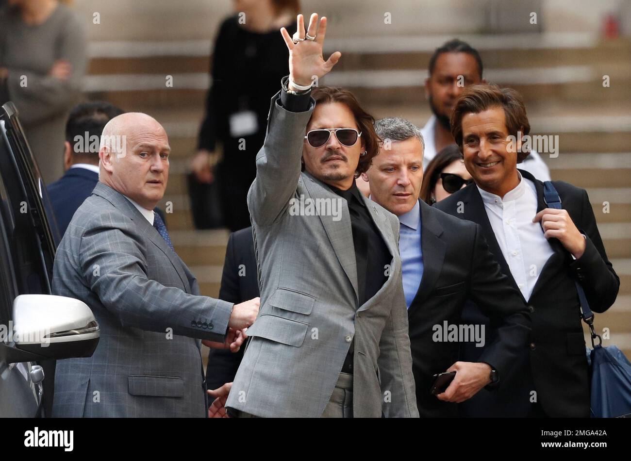 American actor Johnny Depp, waves as he leaves after the end of the ...