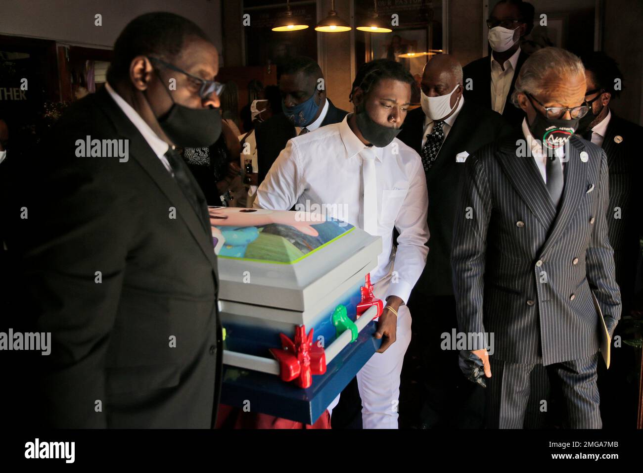 Davell Gardner Sr., center, helps to move the coffin of his son, Davell ...