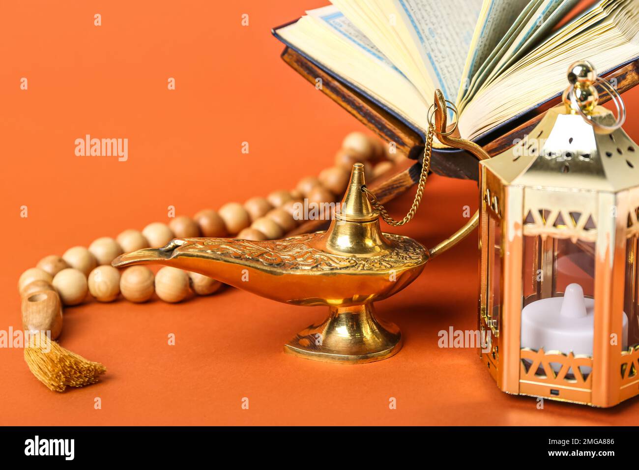 Aladdin lamp of wishes, prayer beads, Koran and Muslim lantern for ...