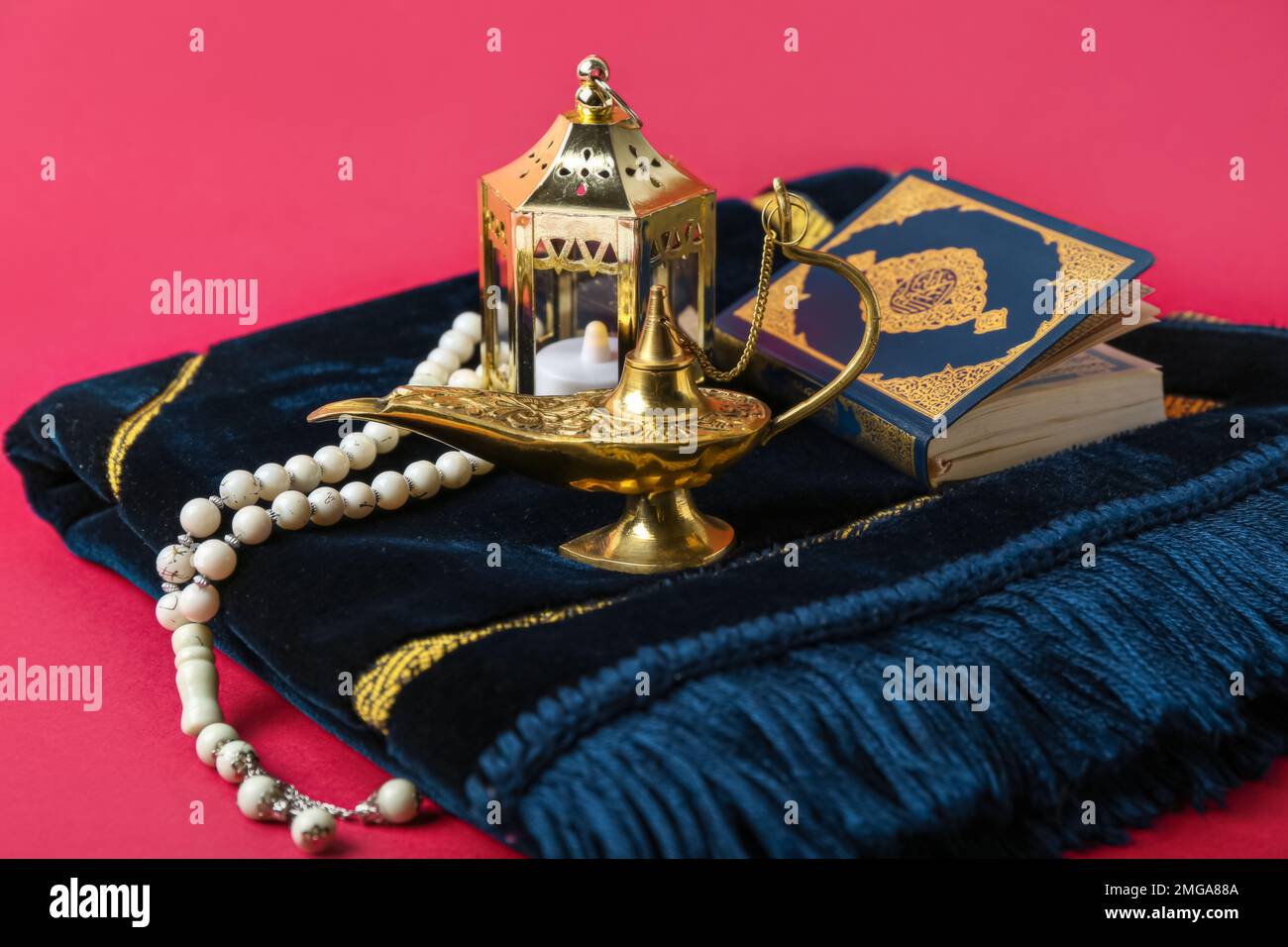 Mat with Aladdin lamp, prayer beads, Muslim lantern and Koran for ...