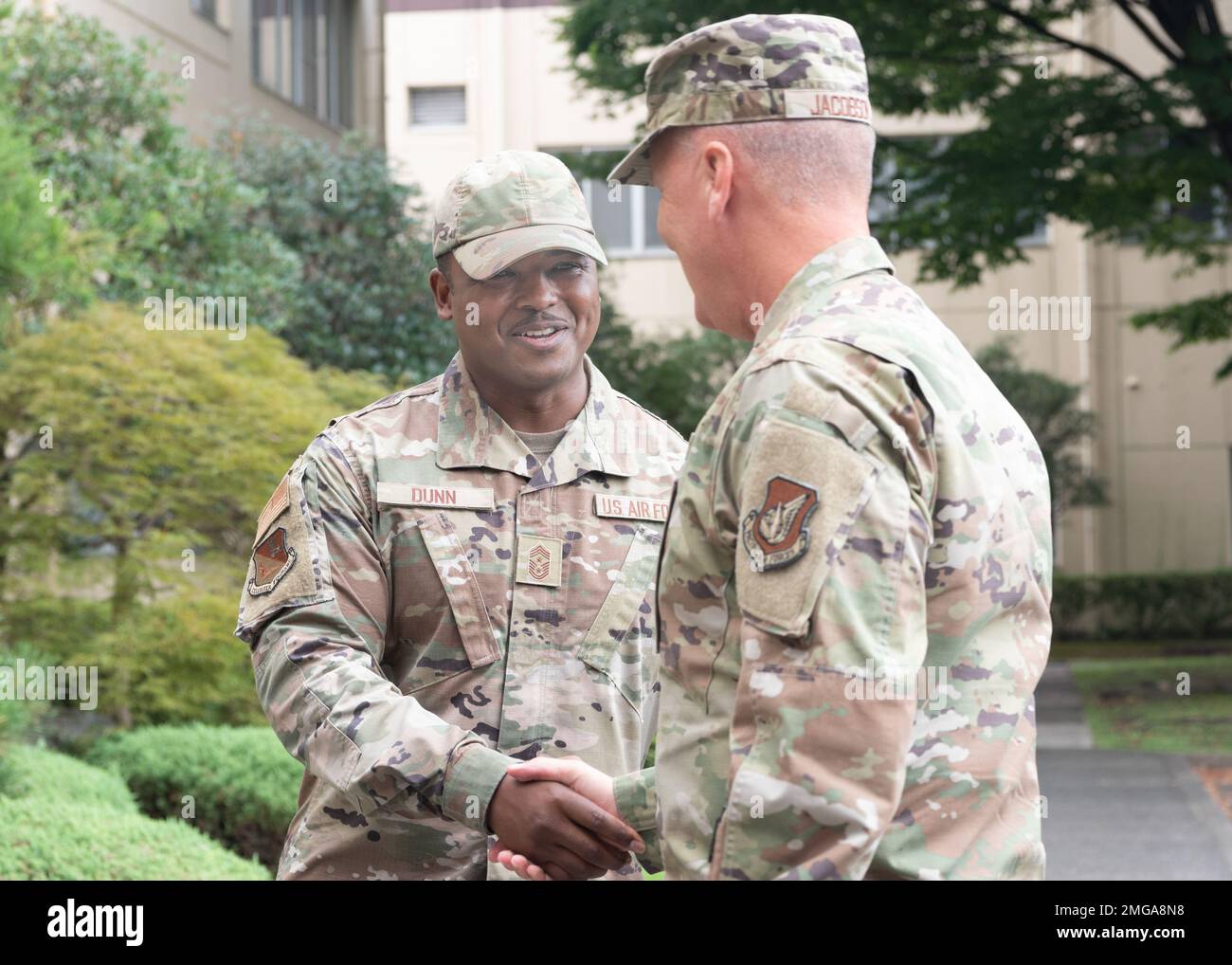 Chief Master Sgt. Jerry Dunn, 374th Airlift Wing command chief, greets ...