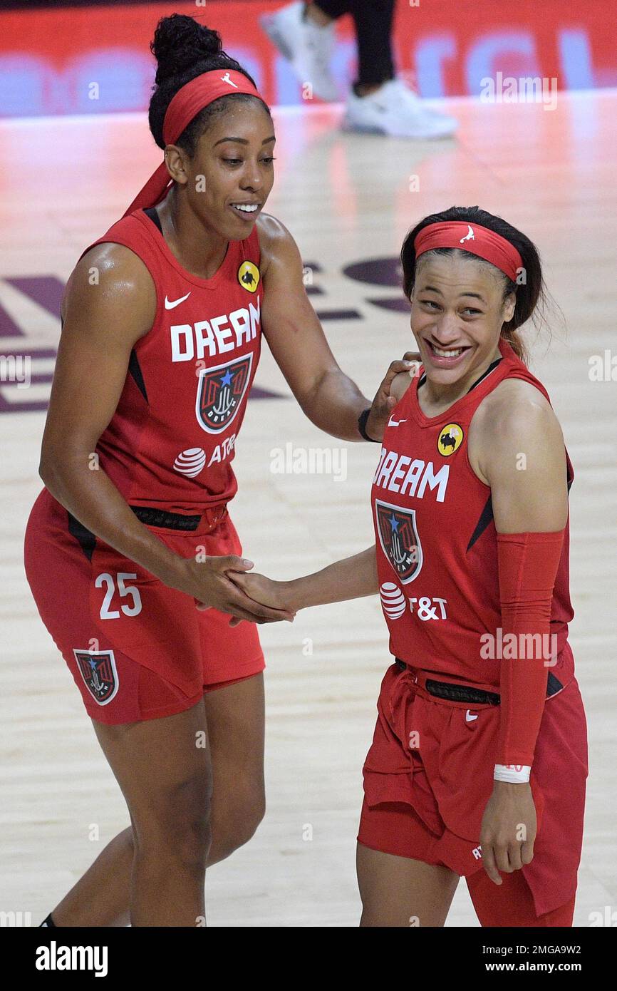 Atlanta Dream forward Monique Billings (25) and guard Chennedy Carter ...