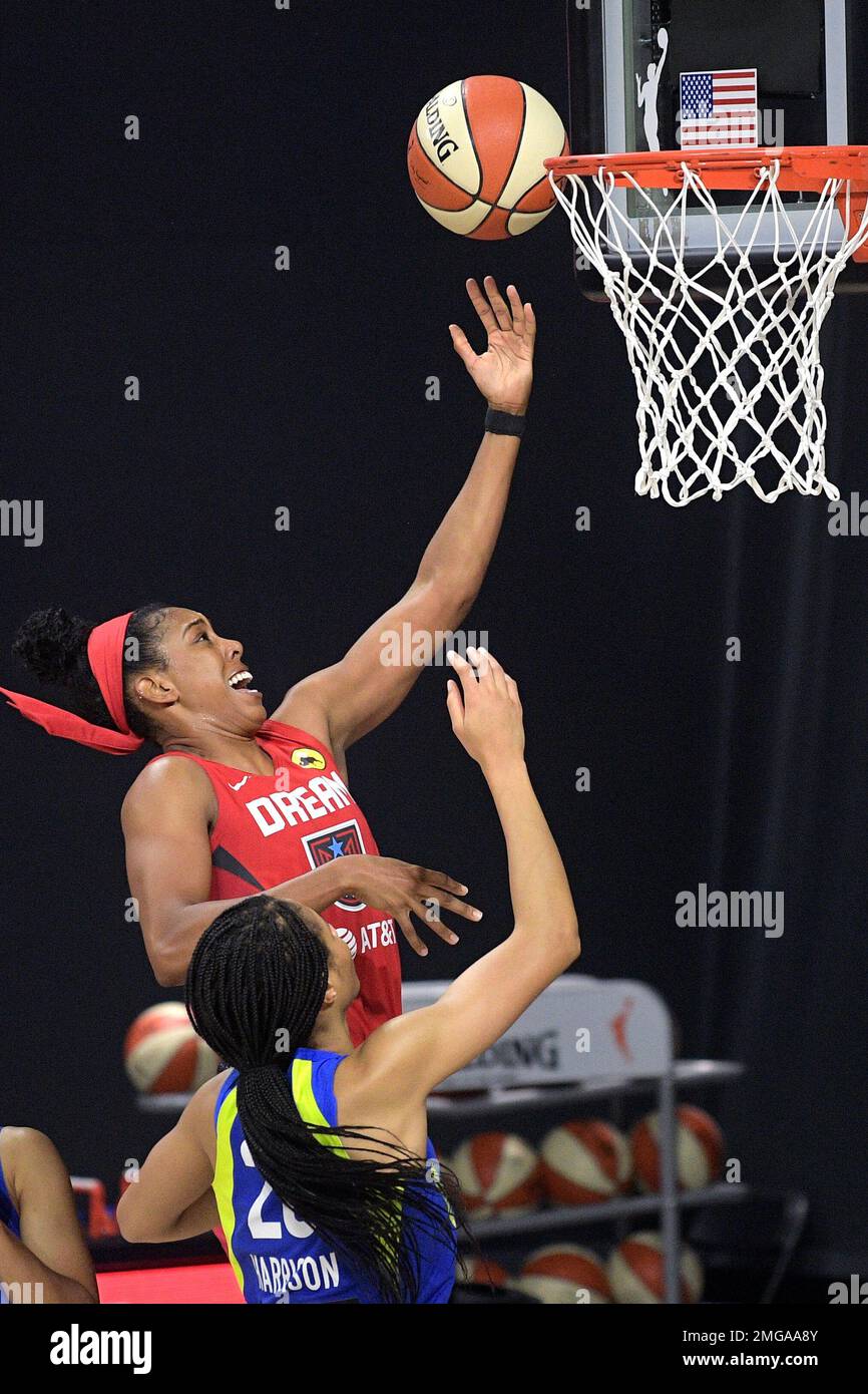 Atlanta Dream forward Monique Billings shoots next to Dallas Wings ...