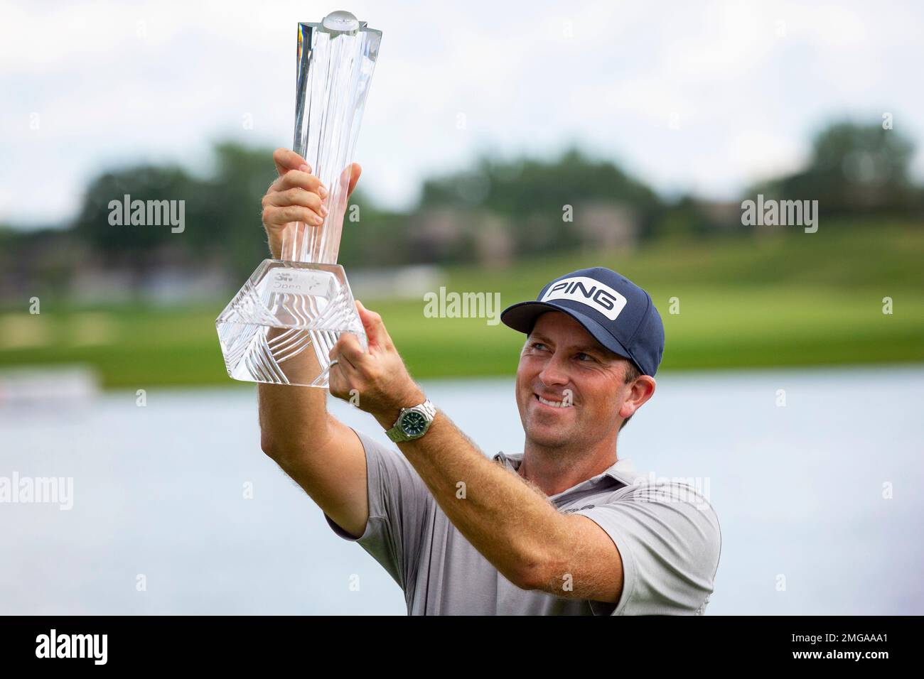 Michael Thompson holds the trophy after winning the 3M Open golf ...