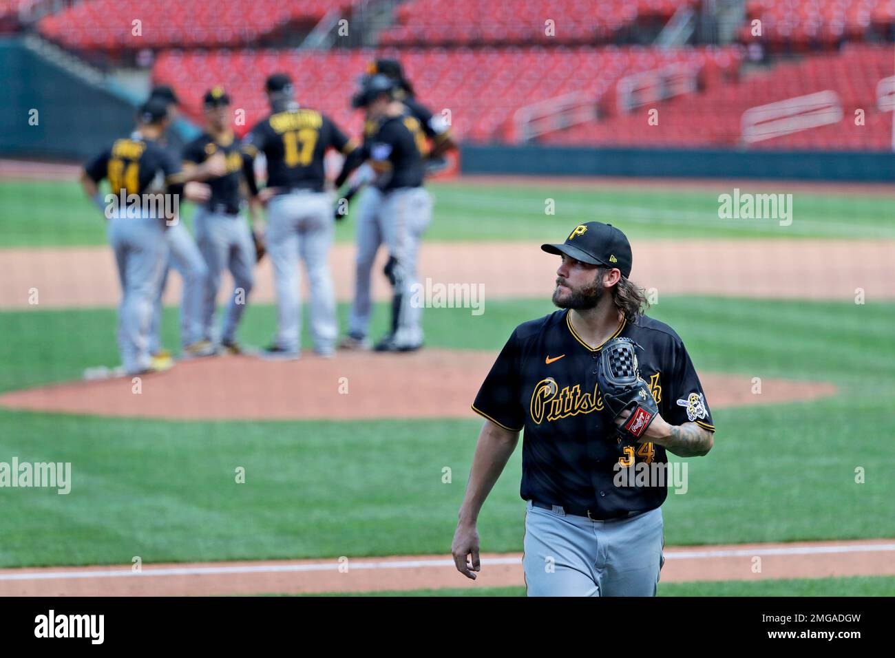 Pittsburgh Pirates starting pitcher Trevor Williams walks off the field ...