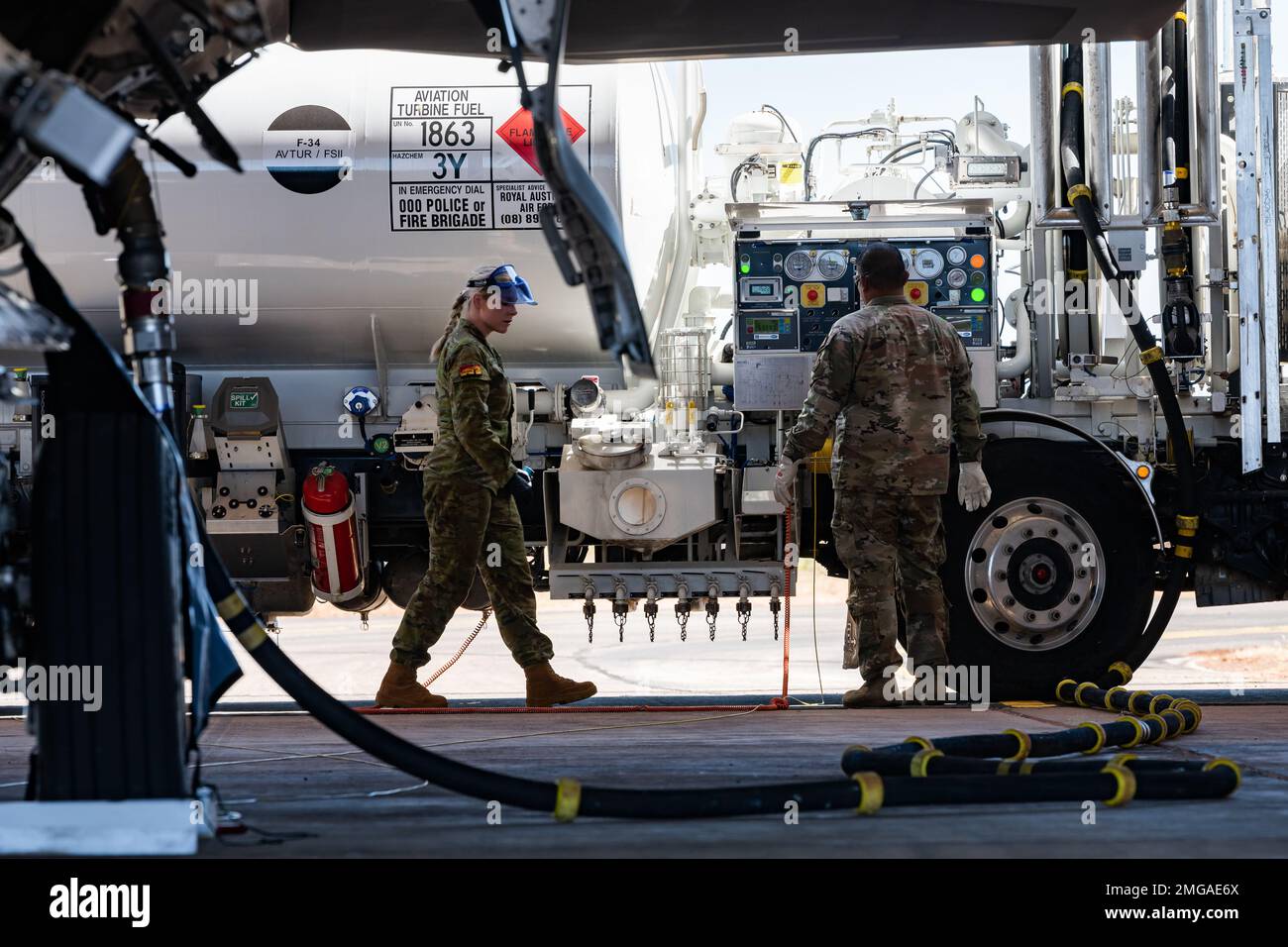 A U.S. Air Force Airman and a Royal Australian Air Force airman operate ...