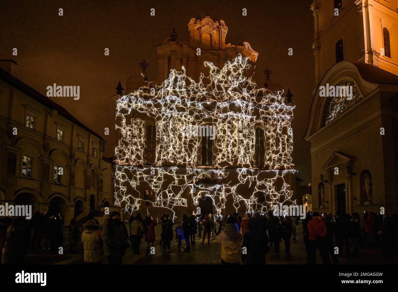 Vilnius, Lithuania. 25th Jan, 2023. People watch the light installation ...