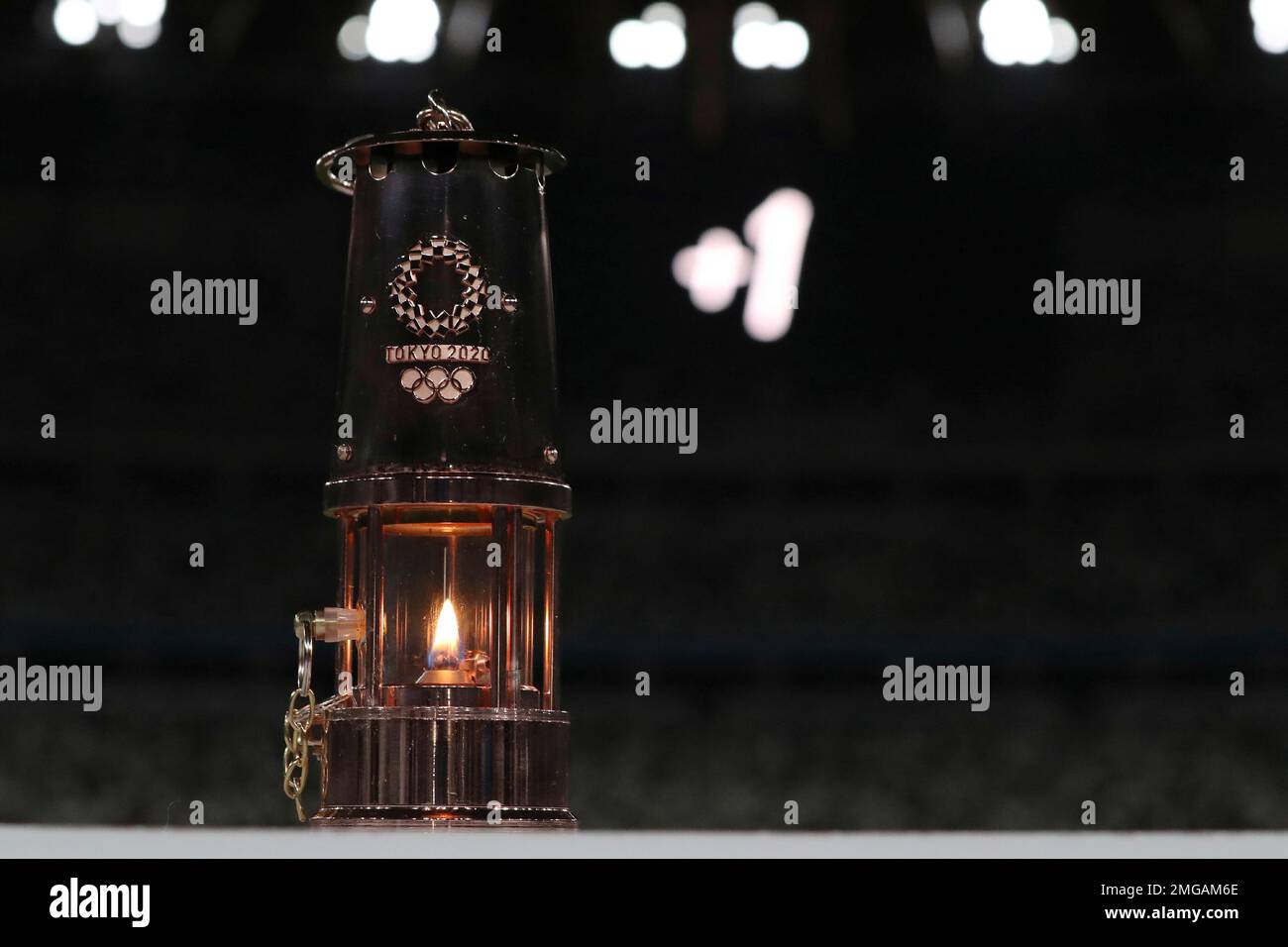 The Olympic flame in a lantern is seen after the "One Step Forward - +1 ...
