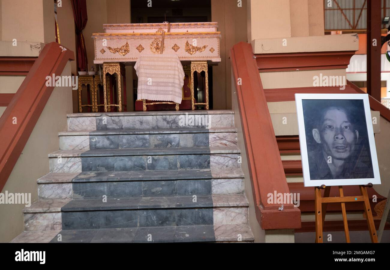 The portrait of the infamous serial killer Si Ouey stands below his ...