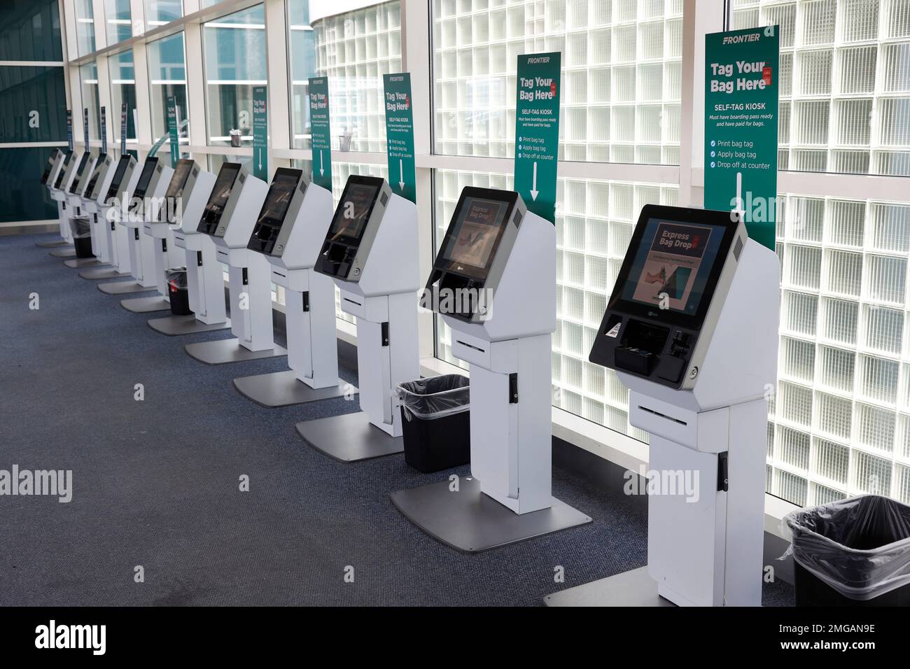 Self-ticketing kiosks for Frontier Airlines stand empty in wait of ...