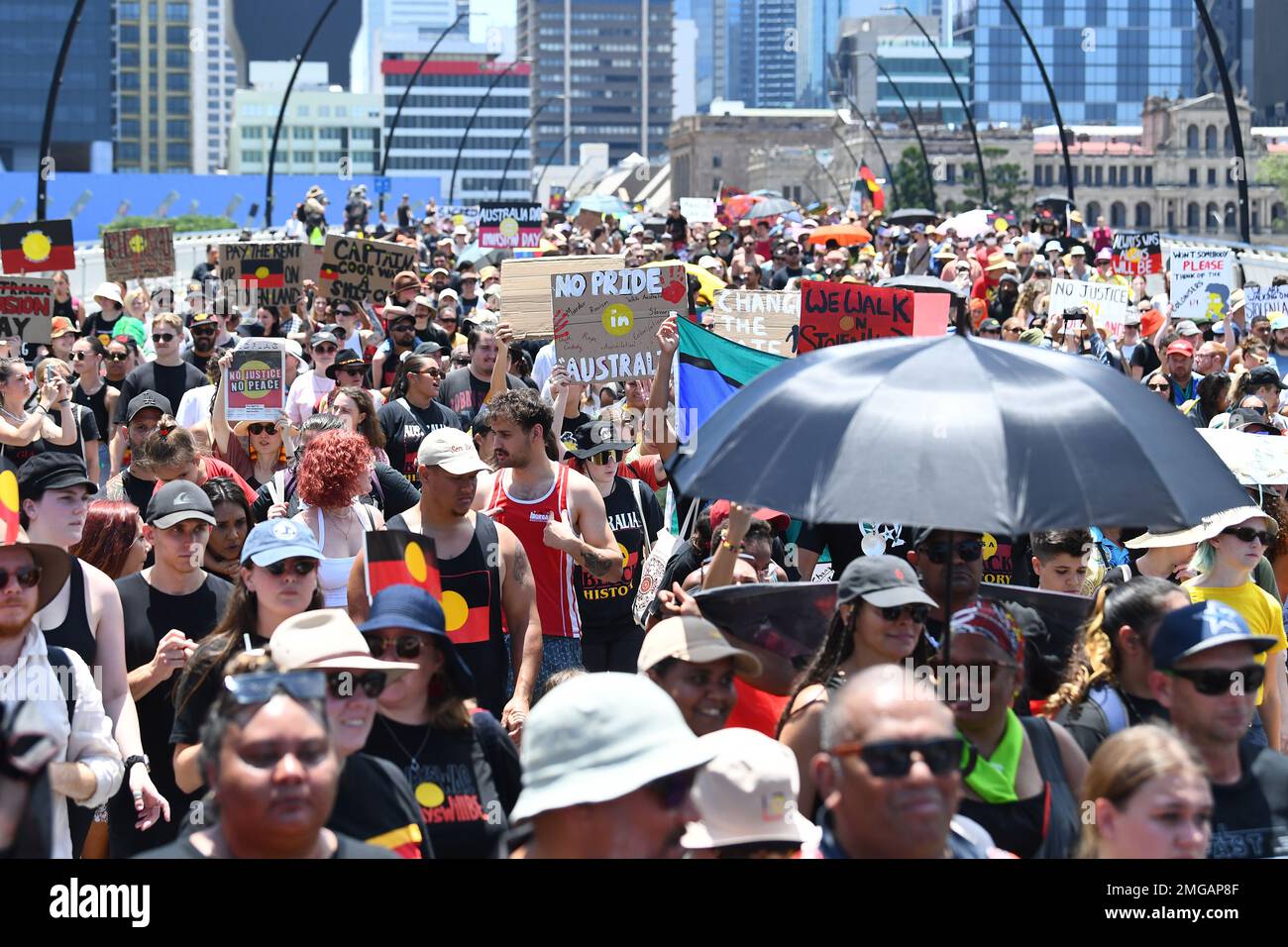 People march during an Invasion Day rally in Brisbane, Thursday ...