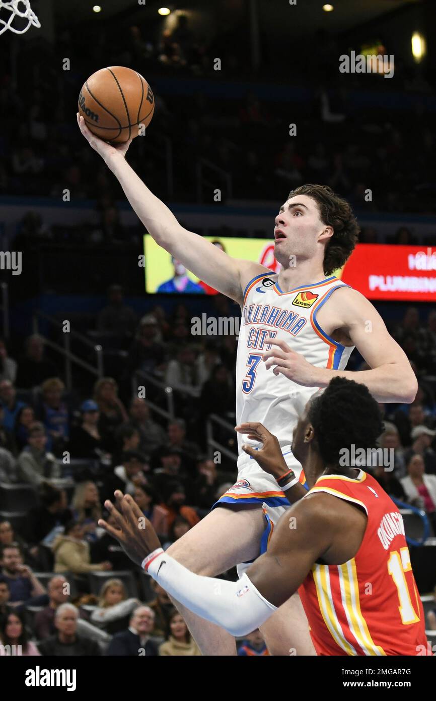 Oklahoma City Thunder guard Josh Giddey (3) goes up for a shot over Atlanta Hawks center Onyeka ...