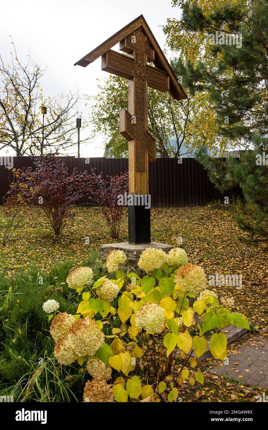 Wooden Orthodox cross at the entrance to the village of Karpovo ...