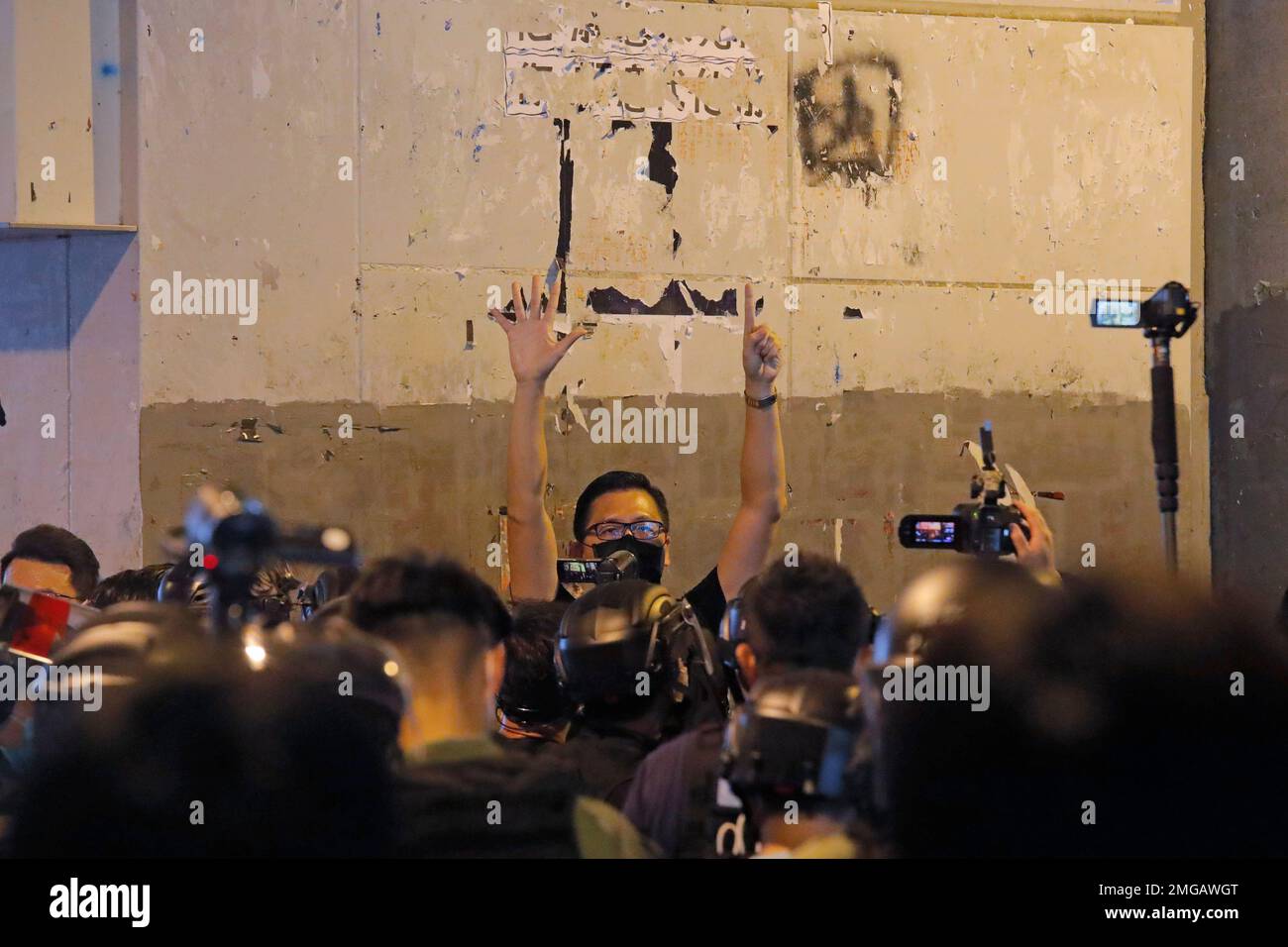 A pro-democracy lawmaker Lam Cheuk-ting, center, gestures with five ...