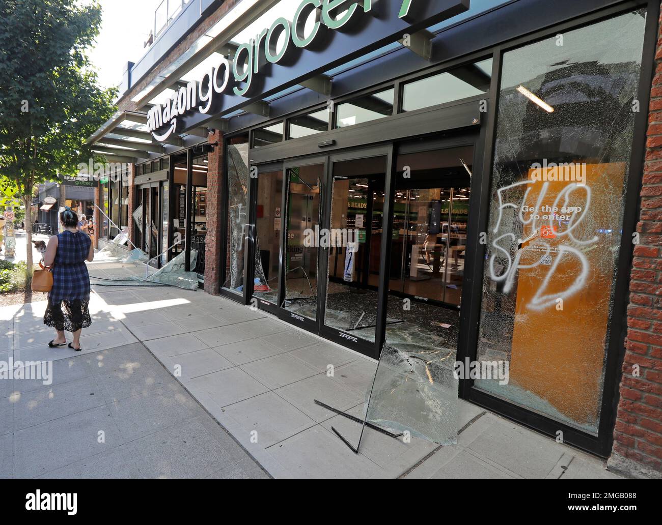 Broken windows and graffiti are shown at the Amazon Go grocery store ...