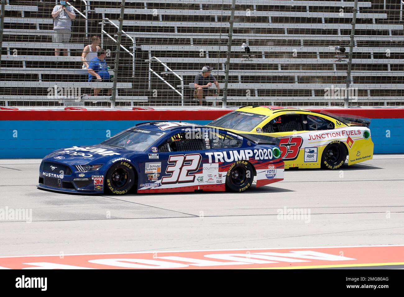 Corey LaJoie (32) leads Garrett Smithley (53) as they come out of Turn ...