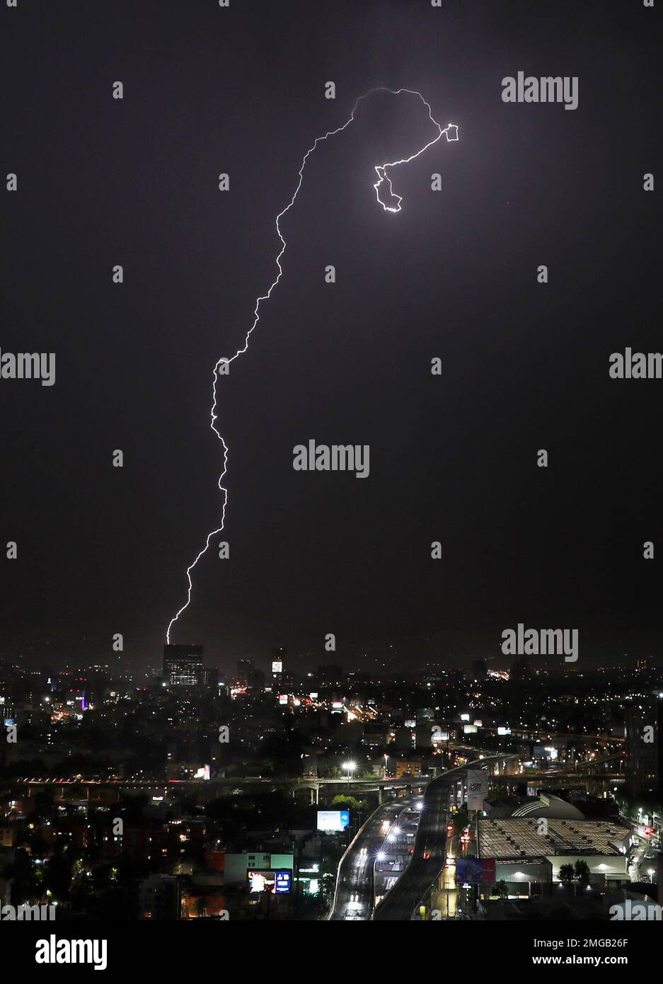 A bolt of lightning strikes during a storm in Mexico City, Saturday ...