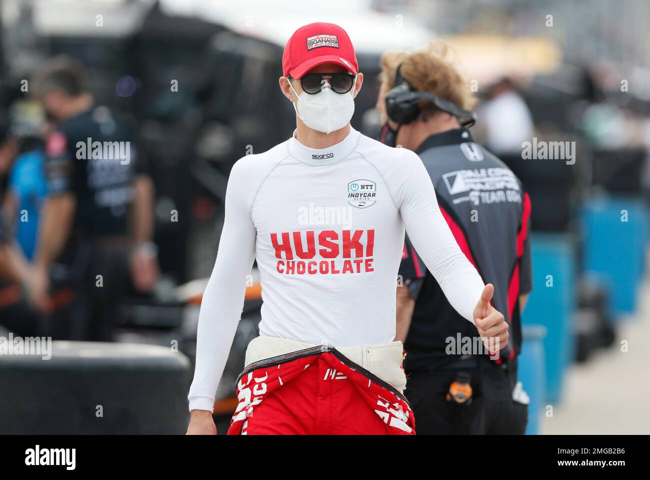 Marcus Ericsson, of Sweden, walks to his car before the IndyCar Series ...