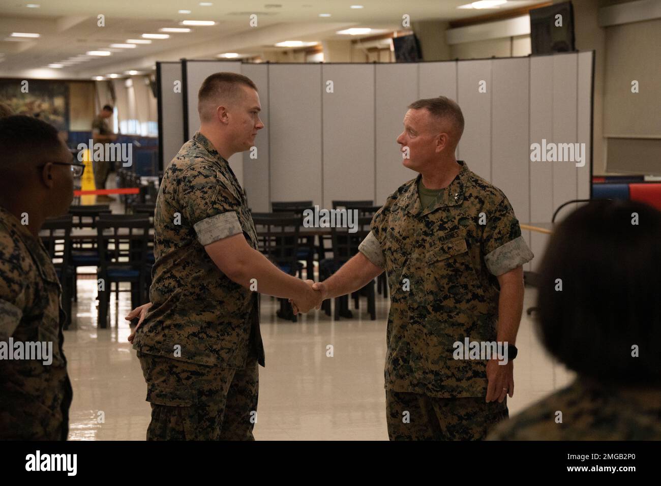 U.S. Marine Corps Sgt. Joseph Baldree, left, a military police officer ...