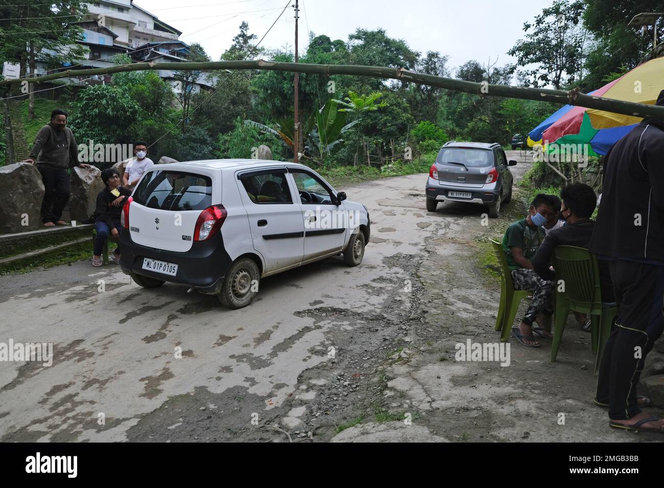 Angami Naga boys check the entry of a car into Kohima village, one of ...