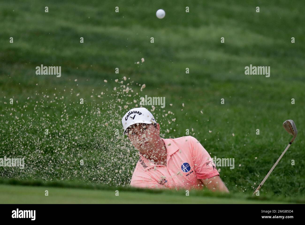 Brian Stuard hits from a bunker toward the 13th green during the second ...