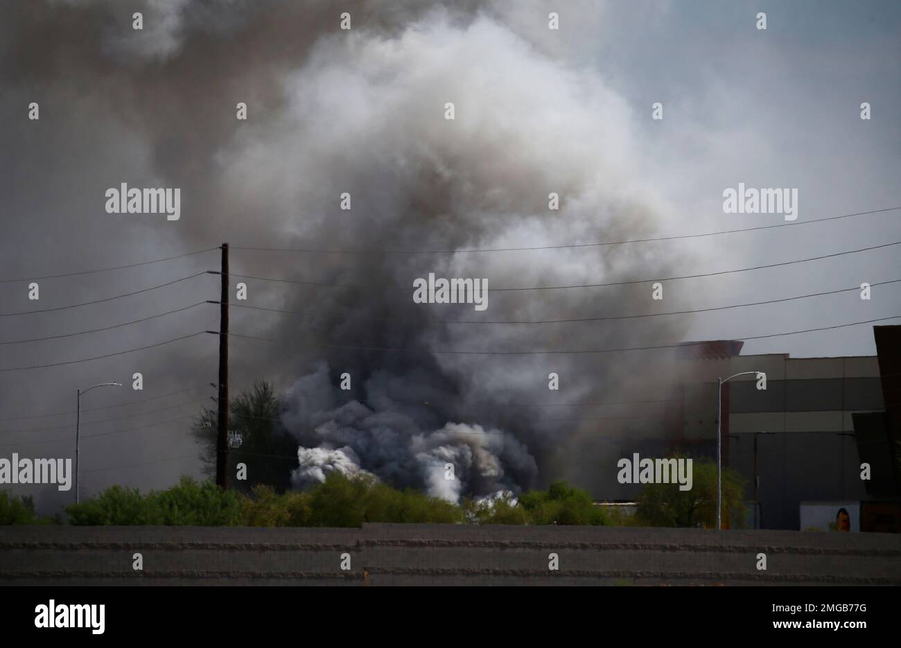 Smoke billows from a truck trailer at an Amazon warehouse Thursday ...