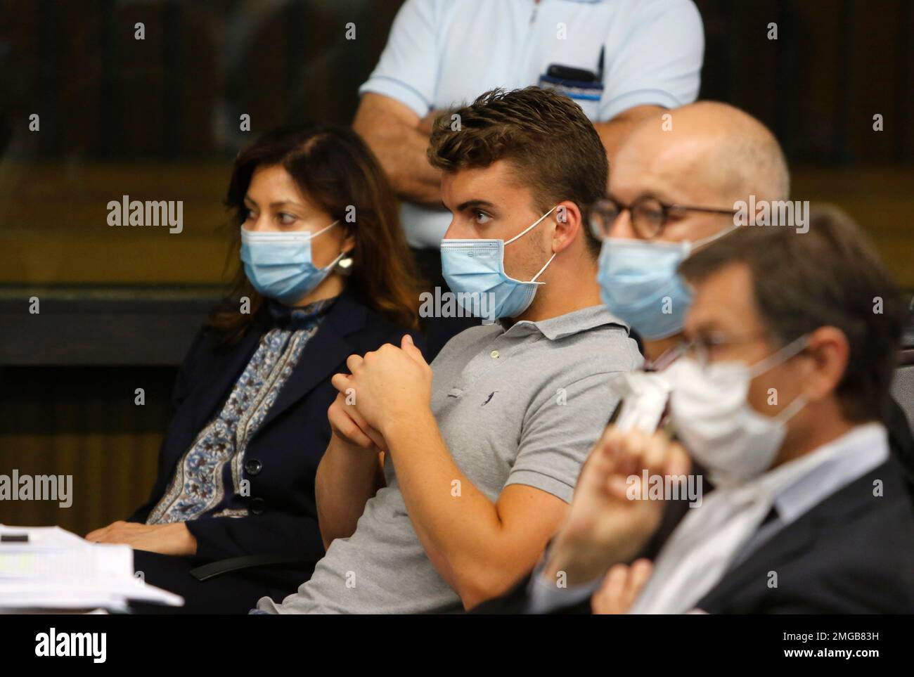 Gabriel Natale-Hjorth, sitting, second from left, sit in the courtroom ...