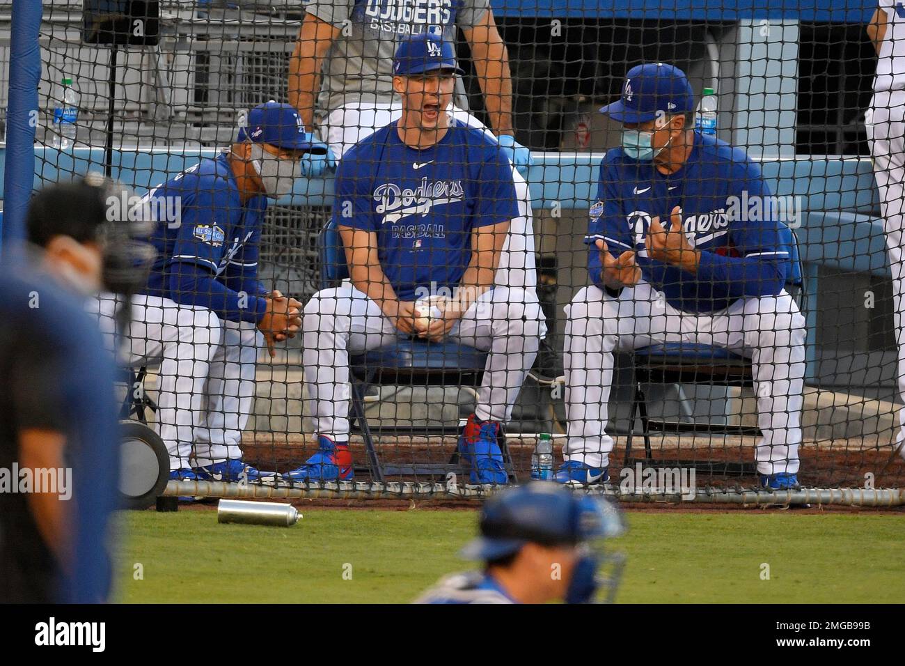 Los Angeles Dodgers manager Dave Roberts, left, talks with coach Bob ...