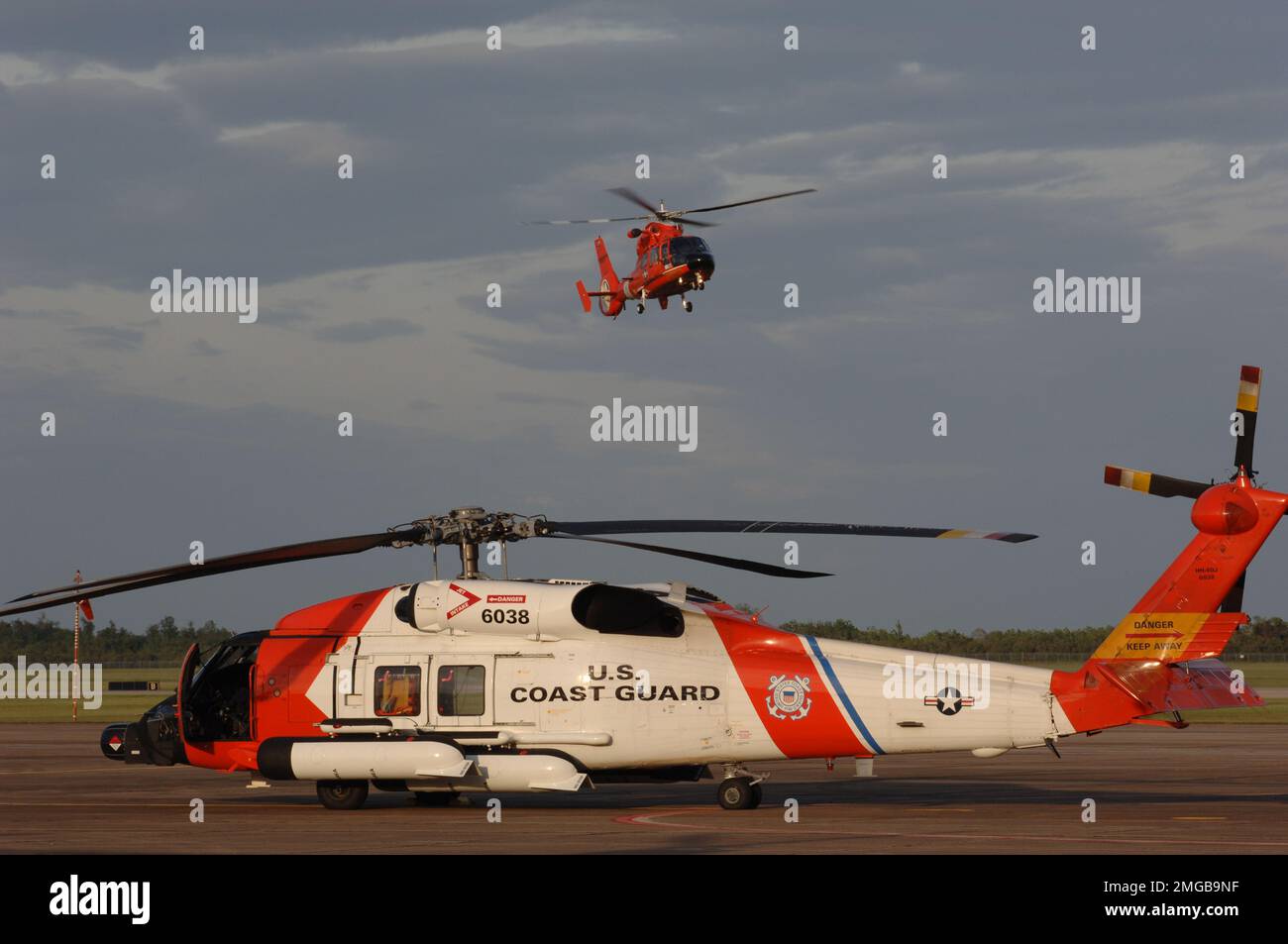 Aircrafts - Miscellaneous - 26-HK-56-26. CG HH-65 flying over HH-6038 ...