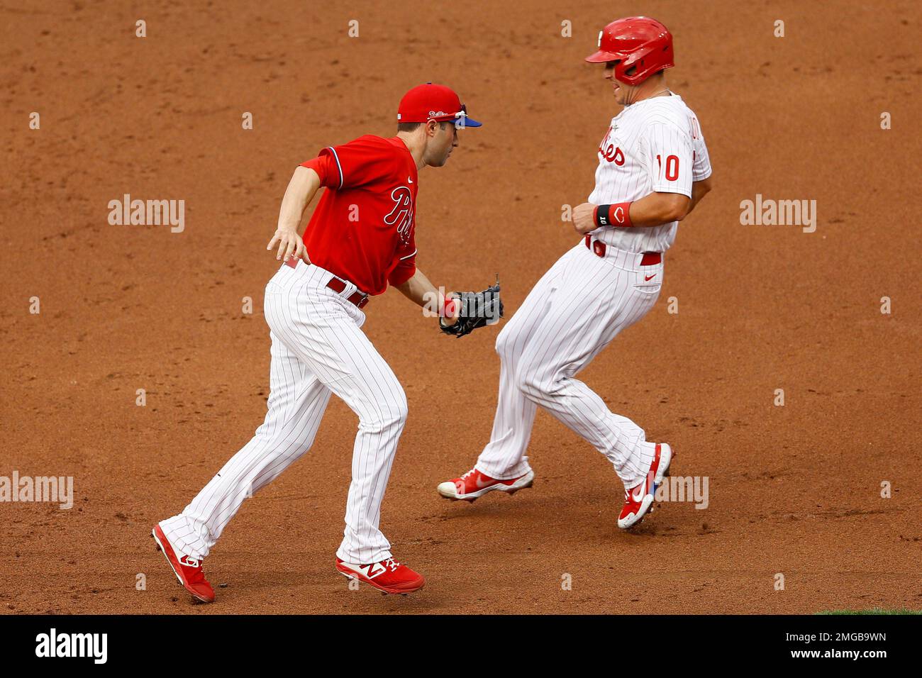 Philadelphia Phillies' J.T. Realmuto, right, is tagged out by second ...
