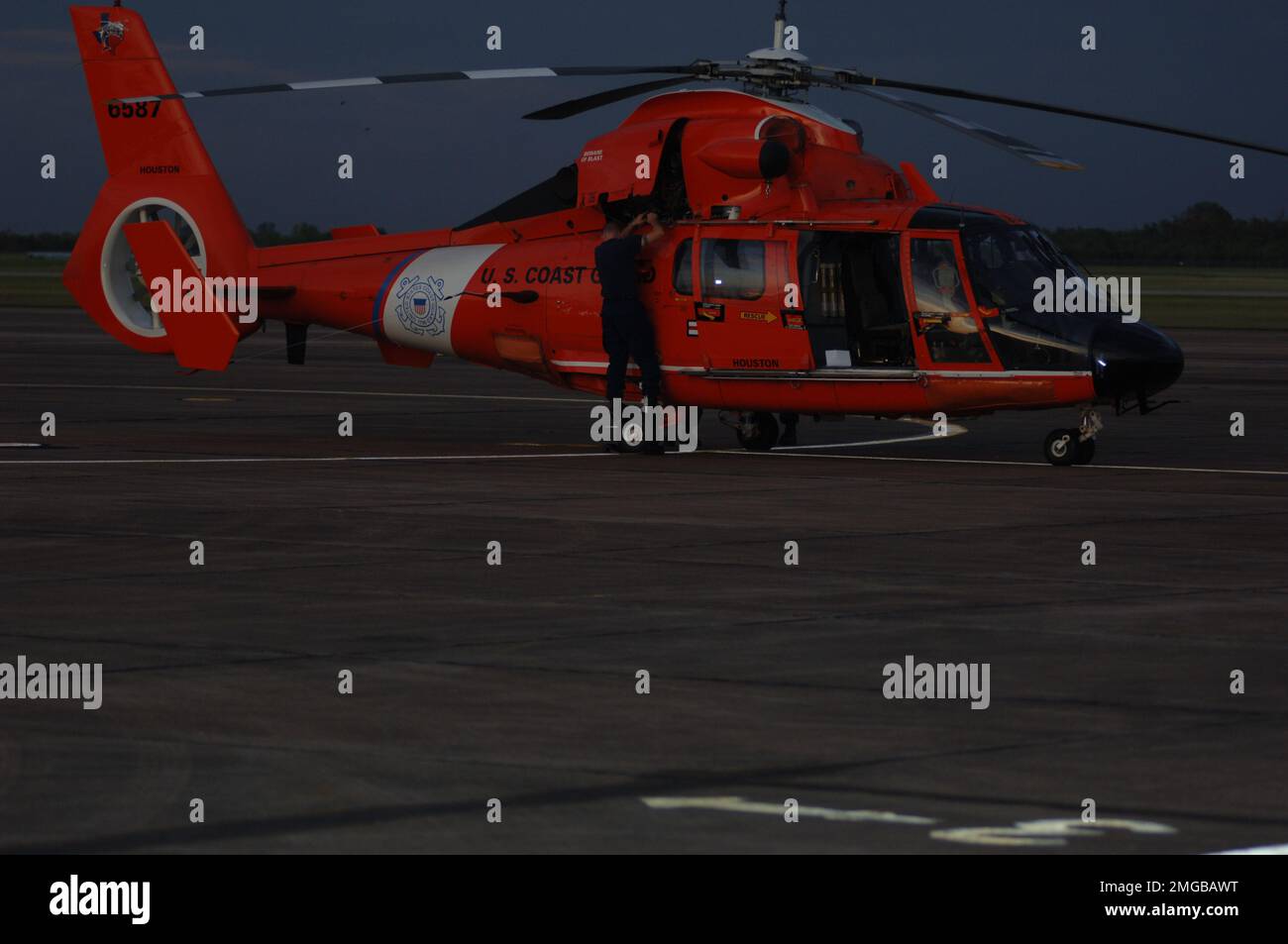 Aircrafts - HH-65 Dolphin - 26-HK-54-91. Coast Guardsman climbing HH-65 ...
