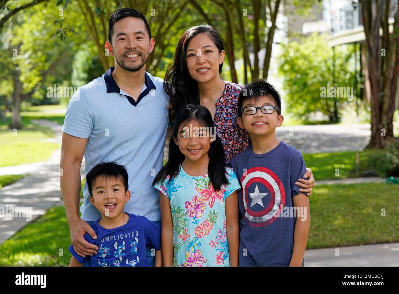 Patrick and Vicky Li Yip pose for a family photograph with their children, from left to right ...