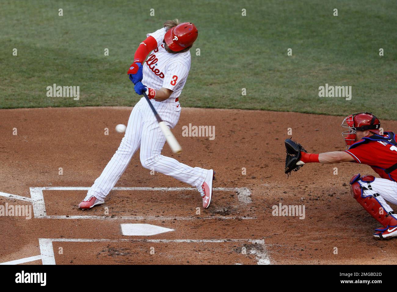 Philadelphia Phillies' Bryce Harper bats as Andrew Knapp catches during ...