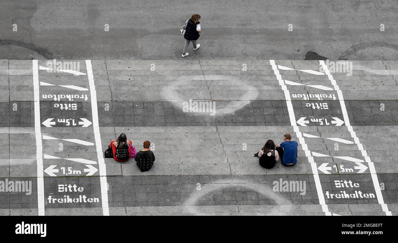 Distancing orders on the pavement at the old town of Duesseldorf remind ...