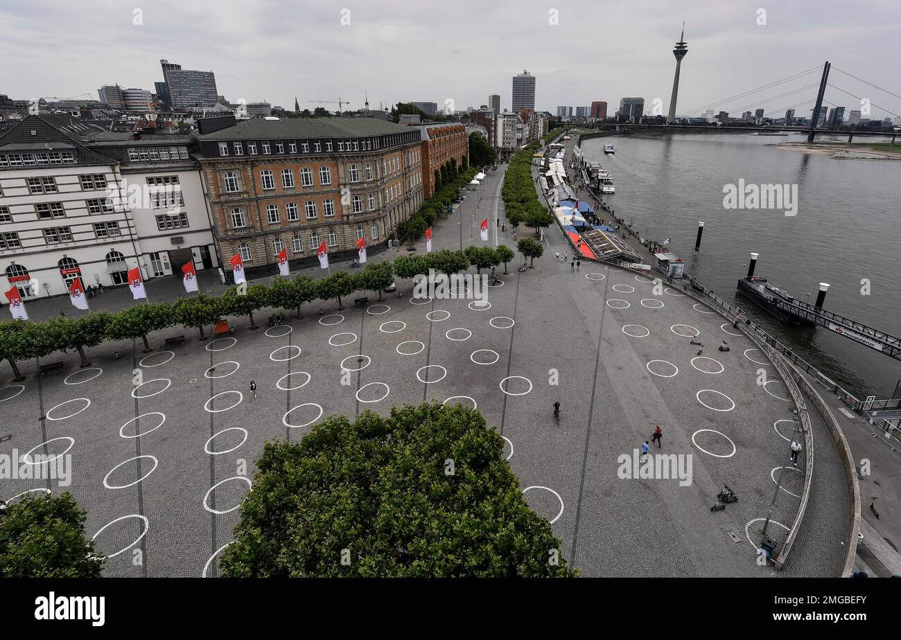 Circles on the pavement at the old town of Duesseldorf remind people of ...
