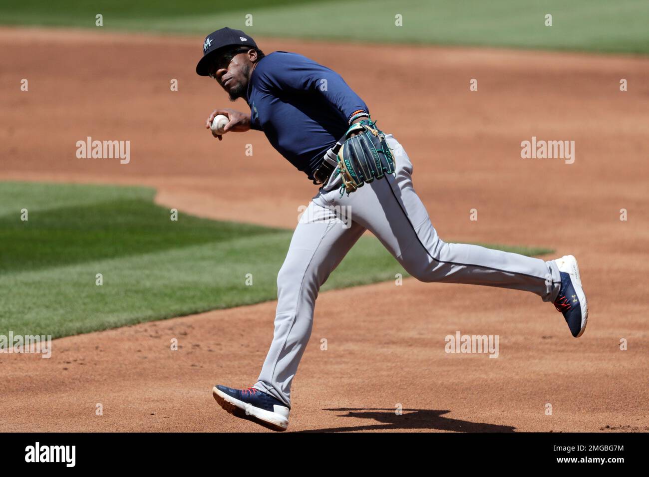 Seattle Mariners infielder Shed Long Jr. throws at a "summer camp ...