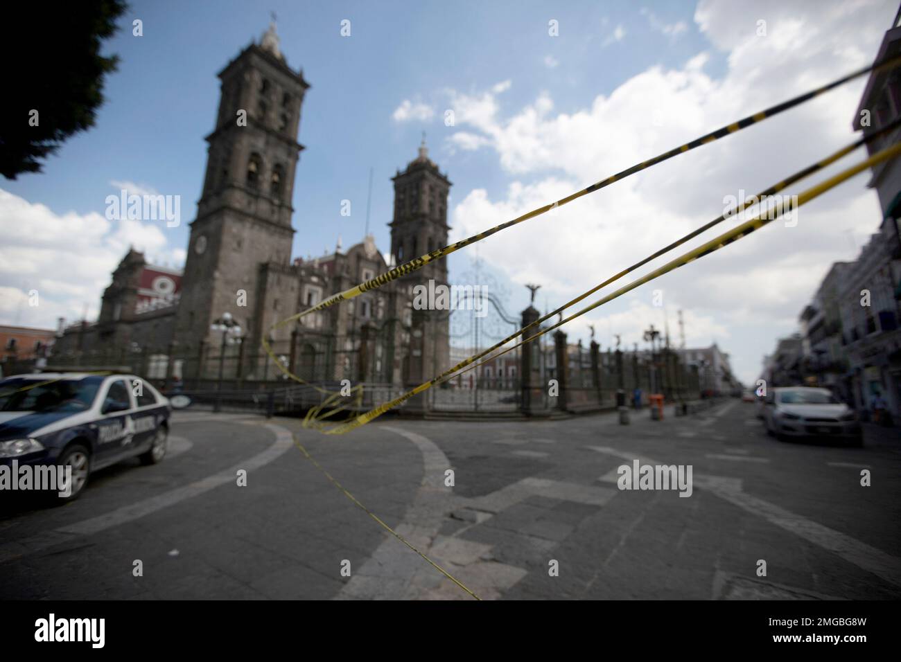 Yellow caution tape cordons off the historic downtown of Puebla in an ...