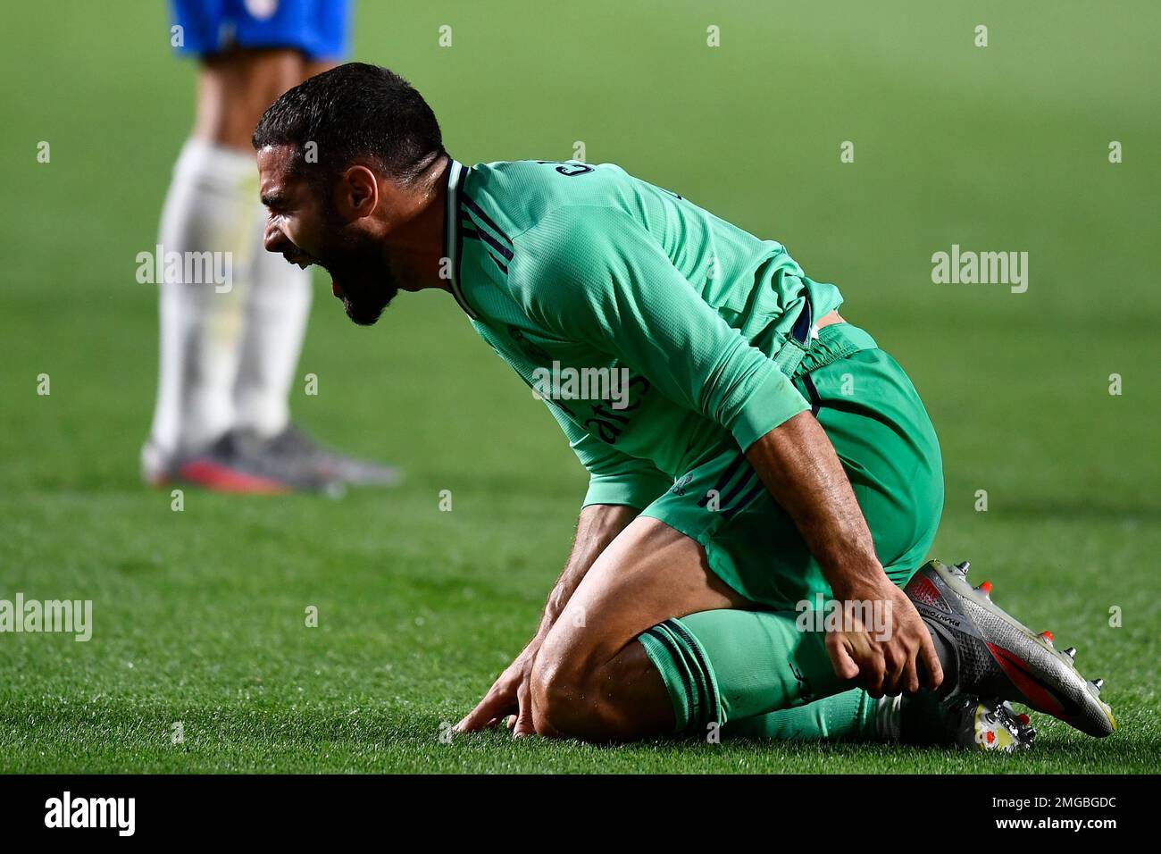 Real Madrid's Dani Carvajal lies on the pitch in pain during the ...