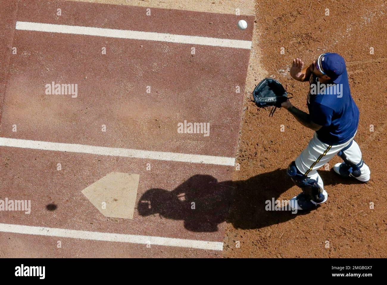 Milwaukee Brewers' Omar Narvaez catches a ball during a practice ...