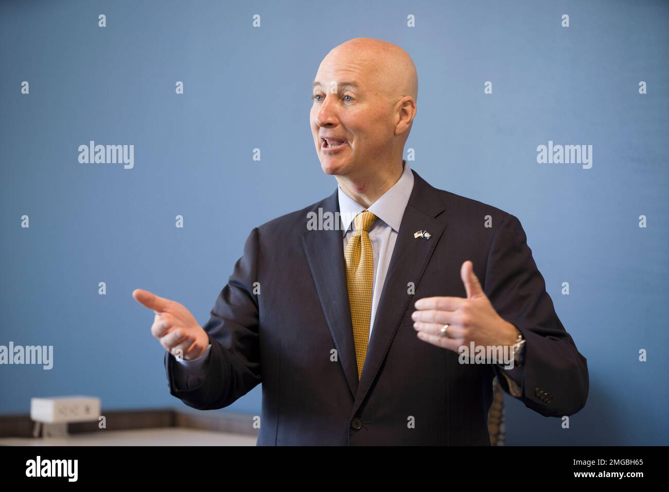 Neb. Gov. Pete Ricketts speaks to reporters during a tour of a new DMV ...